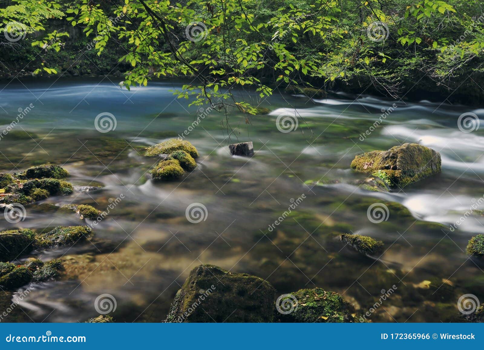 Mesmerizing View of the Greer Spring Crashing into the Rocks in the ...