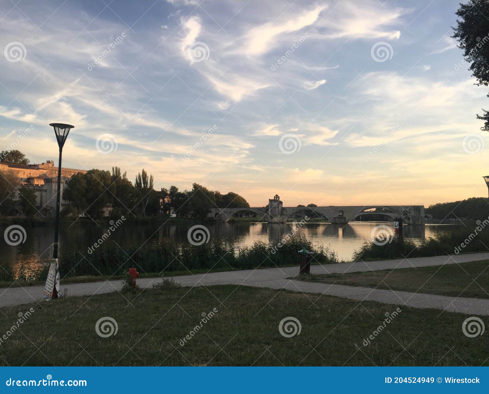 Mesmerizing View of a River with a Bridge at Sunset Stock Image - Image ...