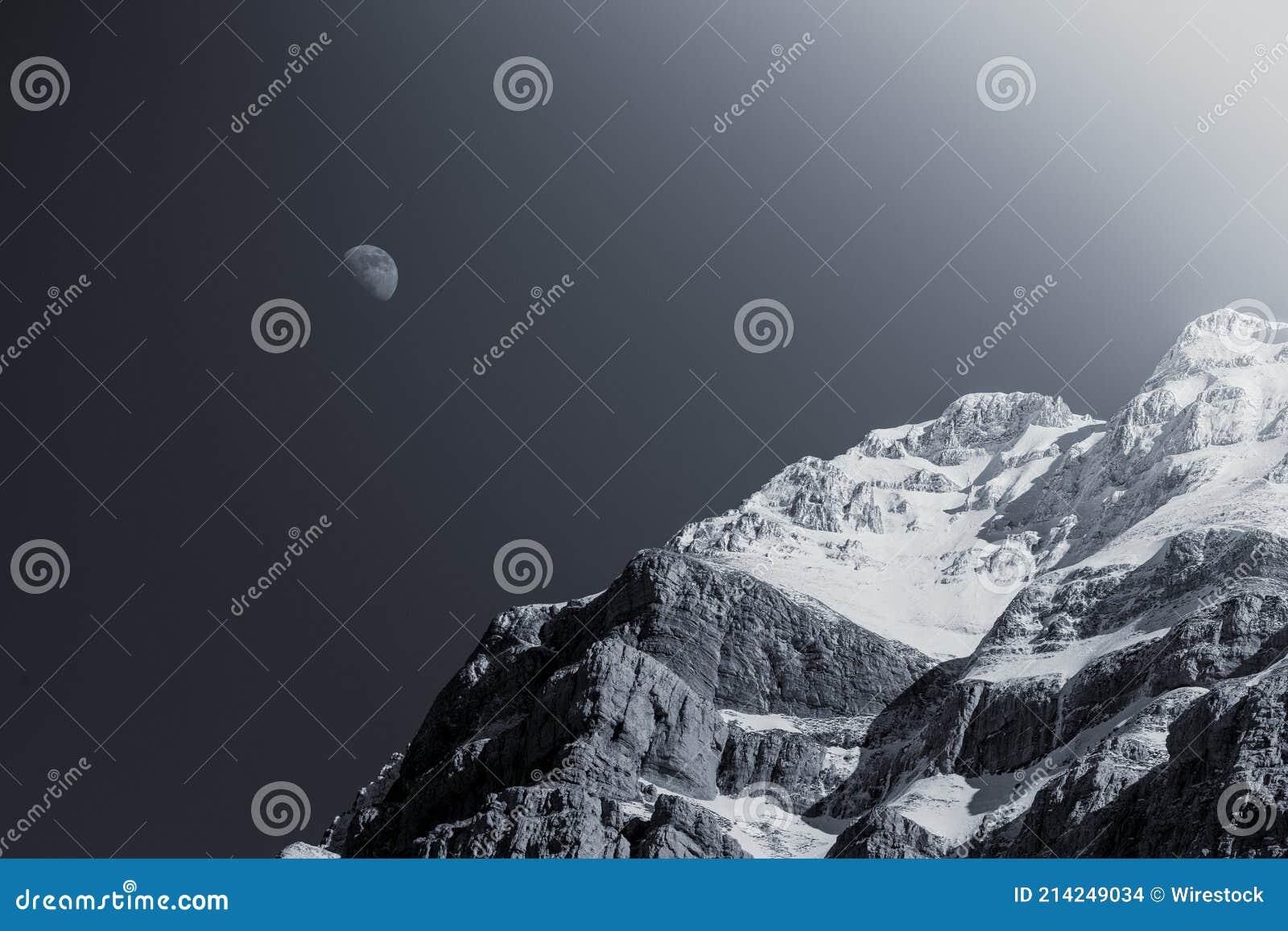 Mesmerizing View of a Rocky Mountain and the Moon in the Dark Sky Stock ...