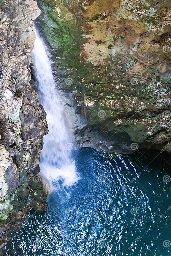 Mesmerizing Waterfall Inside a Mysterious Cave with a Plunge Pool Stock ...