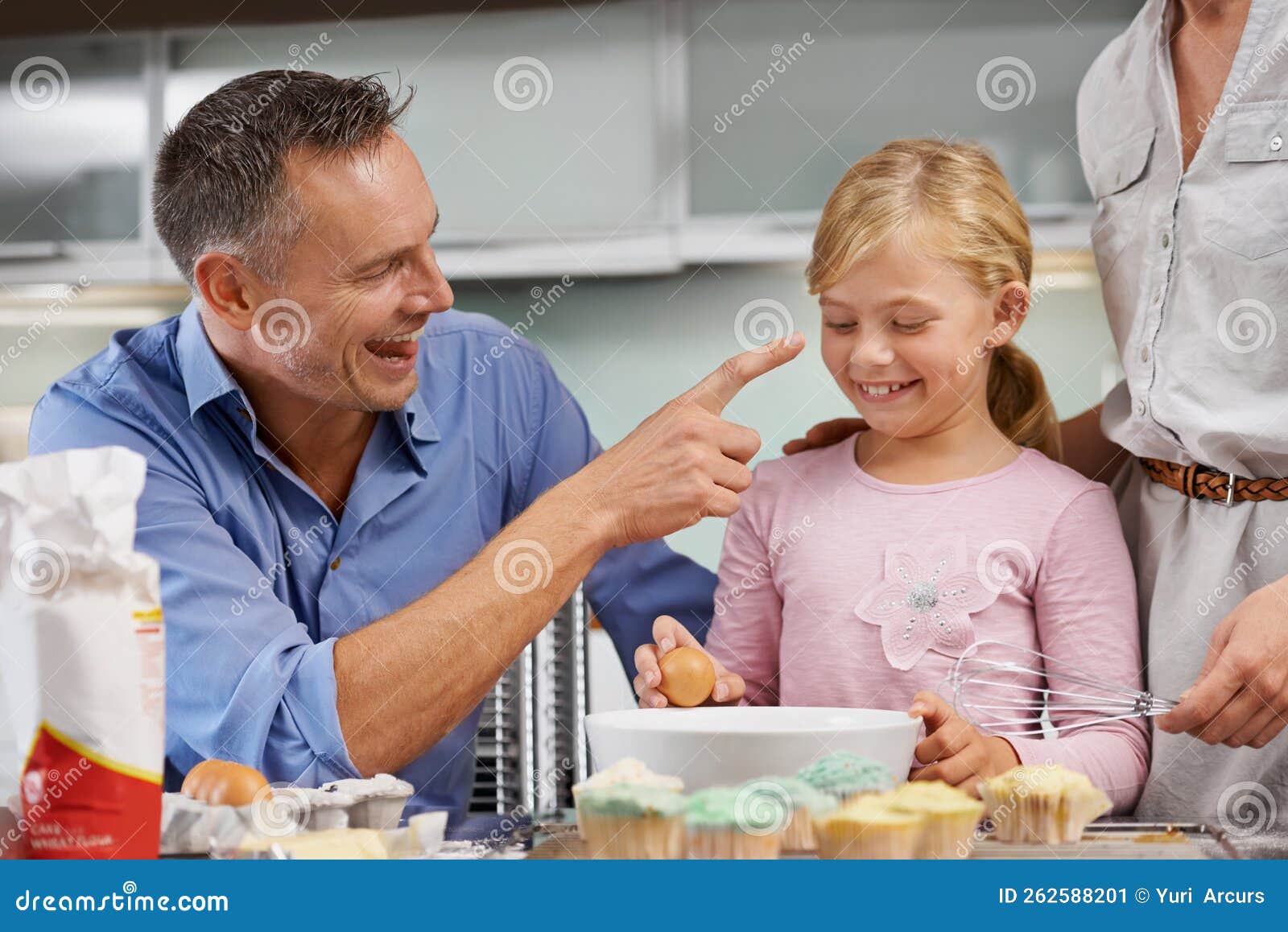 Mess is Half the Fun. a Family Baking Together and Laughing. Stock ...