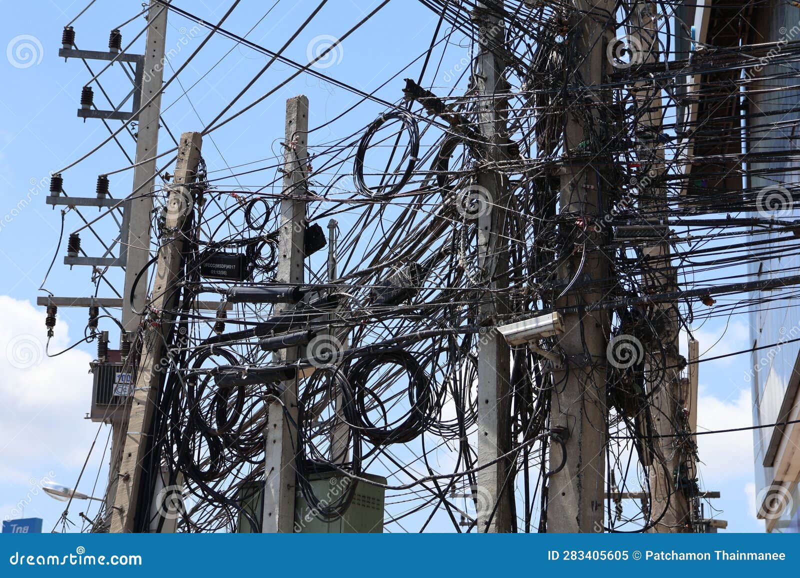 A Mess of Power Poles and Wires, Cabling Systems, and Internet Towers ...