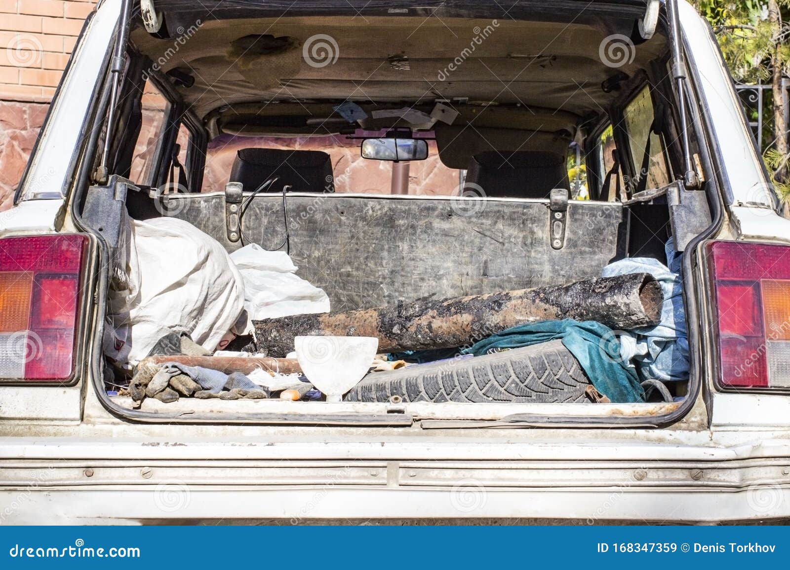 A Mess in the Trunk of a White Car, the Front and Back Background ...