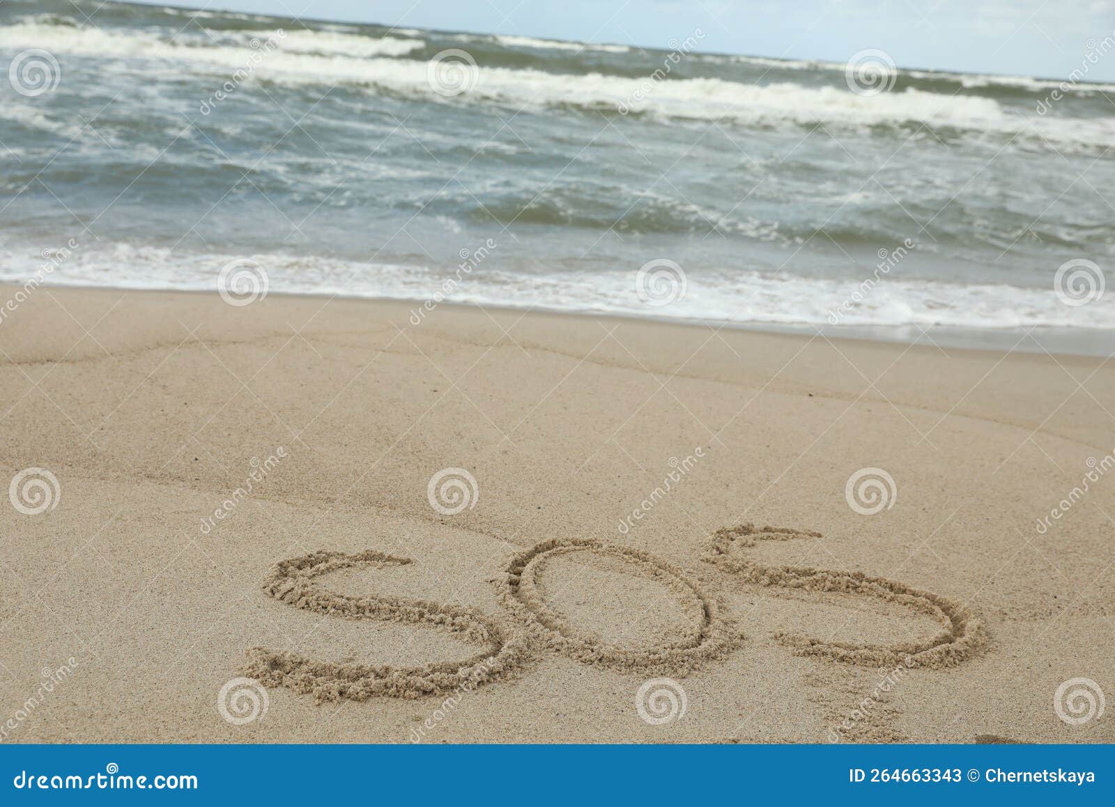 Message SOS Drawn on Sand Near Sea Stock Image - Image of dangerous ...