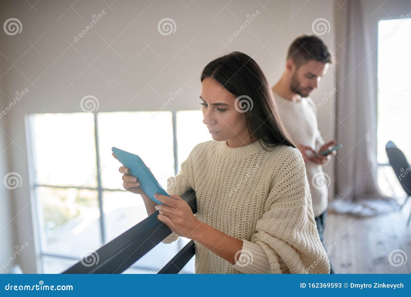 Wife Feeling Suspicious while Reading Messages on Tablet Stock Image ...