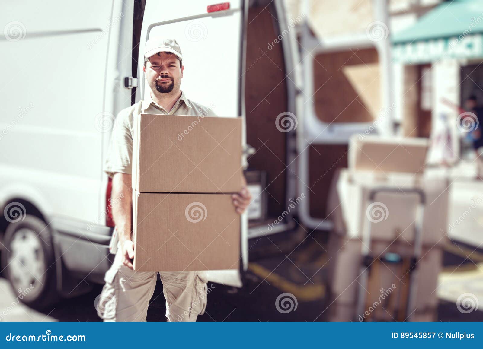 Messenger Delivering Parcel, Standing Next To His Van Stock Image ...