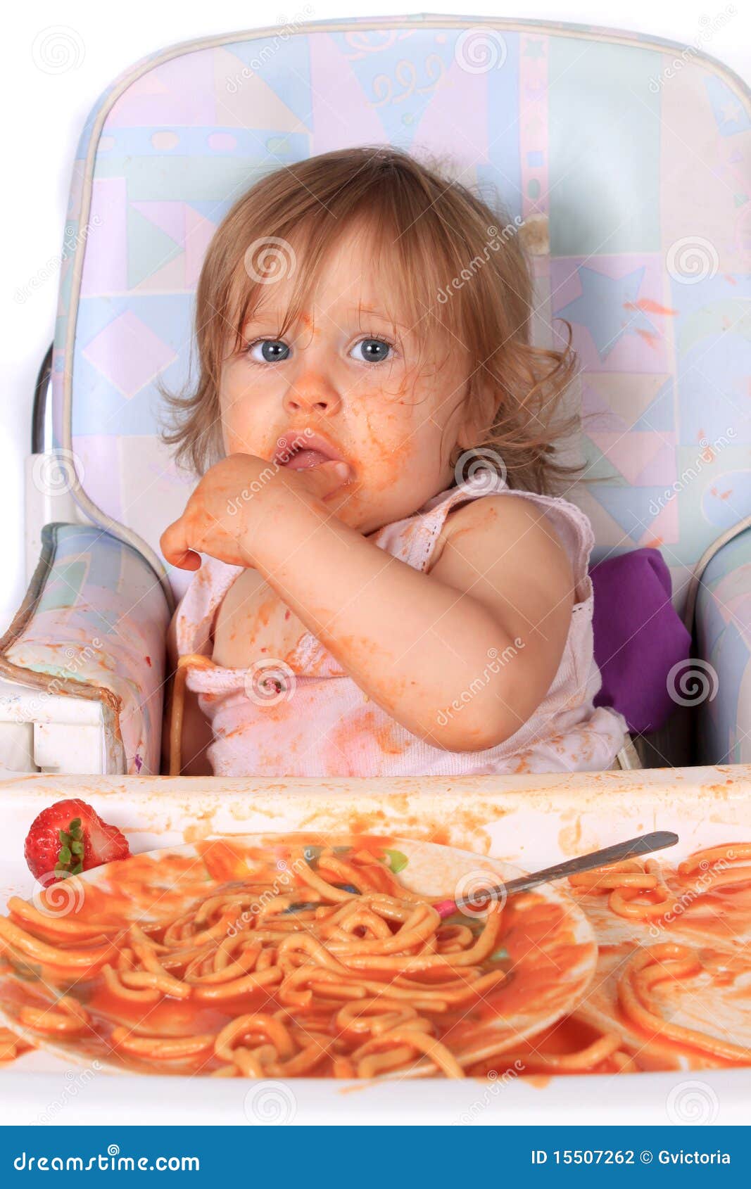 Messy Baby Girl Eating Spaghetti Stock Photo - Image of fingers, chair ...