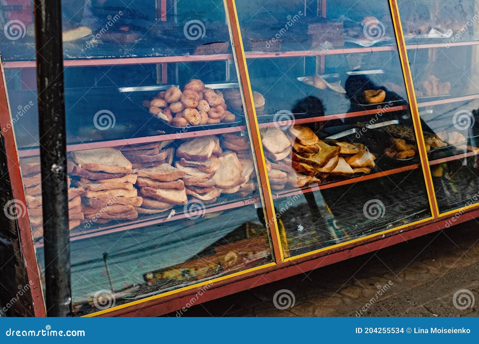 Messy Bakery Showcase with Leftover Bread Stock Photo - Image of retail ...