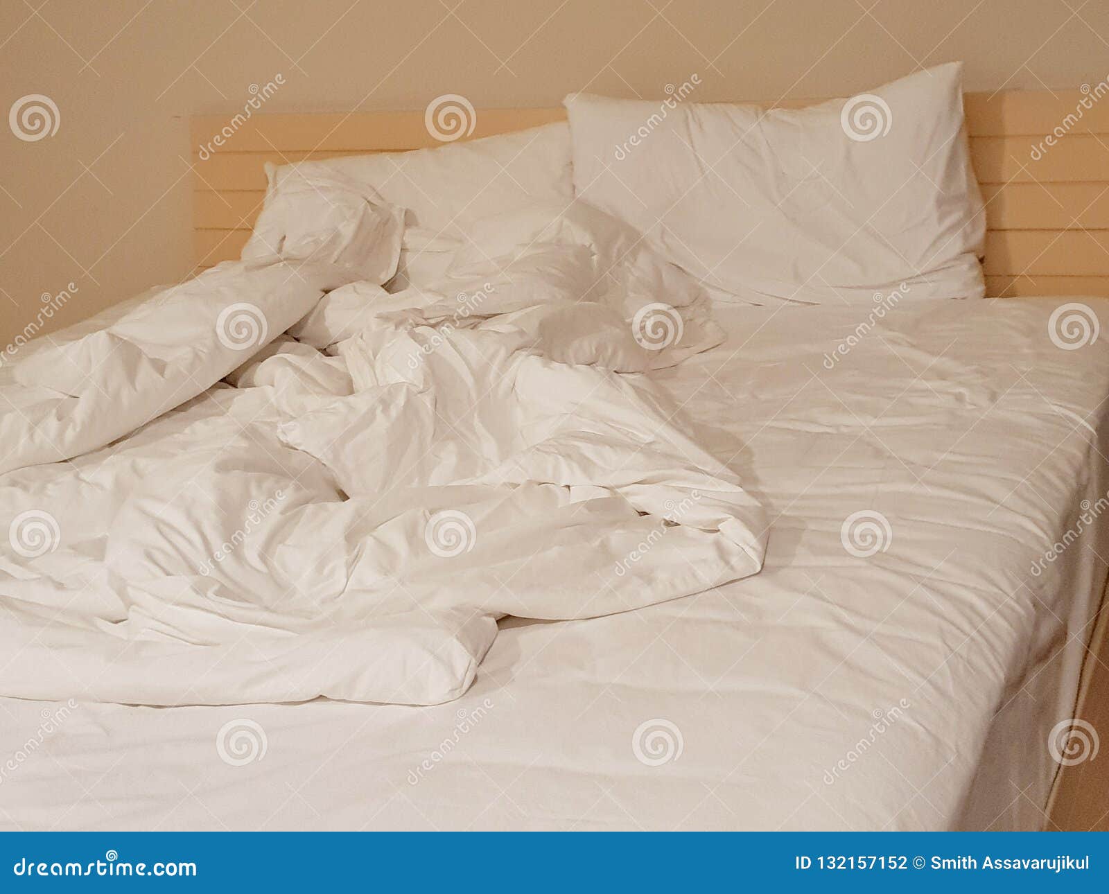 Messy bed in hotel stock photo. Image of white, crumpled - 132157152
