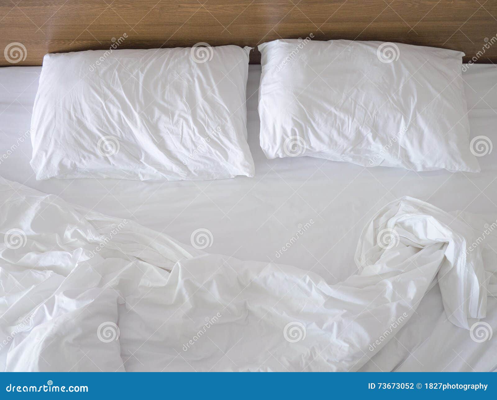 Messy bed not tidy stock photo. Image of pillows, household - 73673052