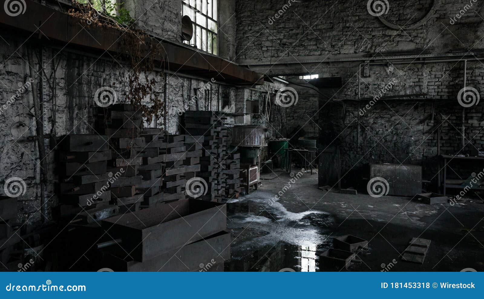 Messy Building with Stacks of Metals and a Concrete Brick Wall Stock ...