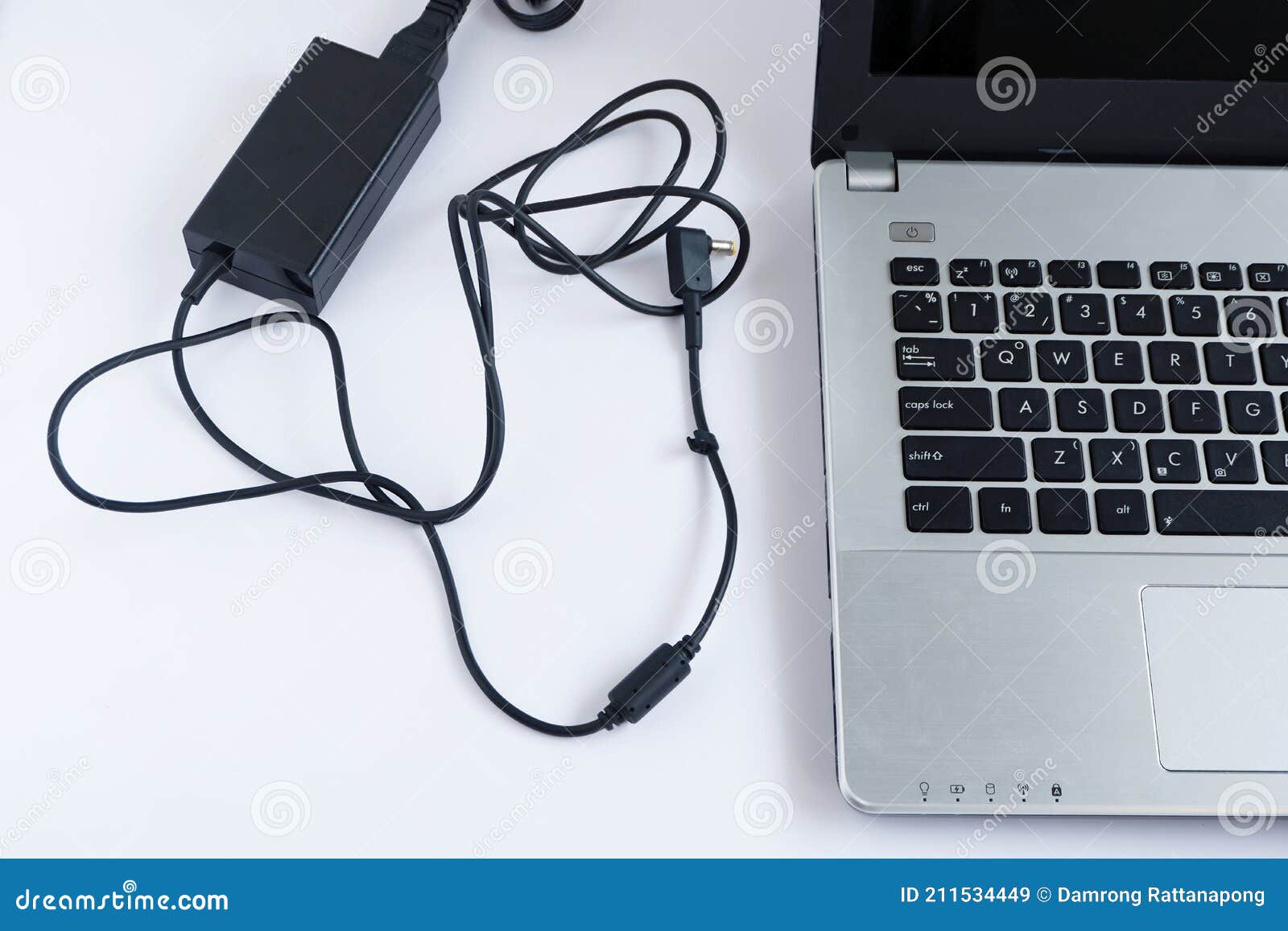 Messy Charging Cable Adapter of Laptop Computer on White Background ...