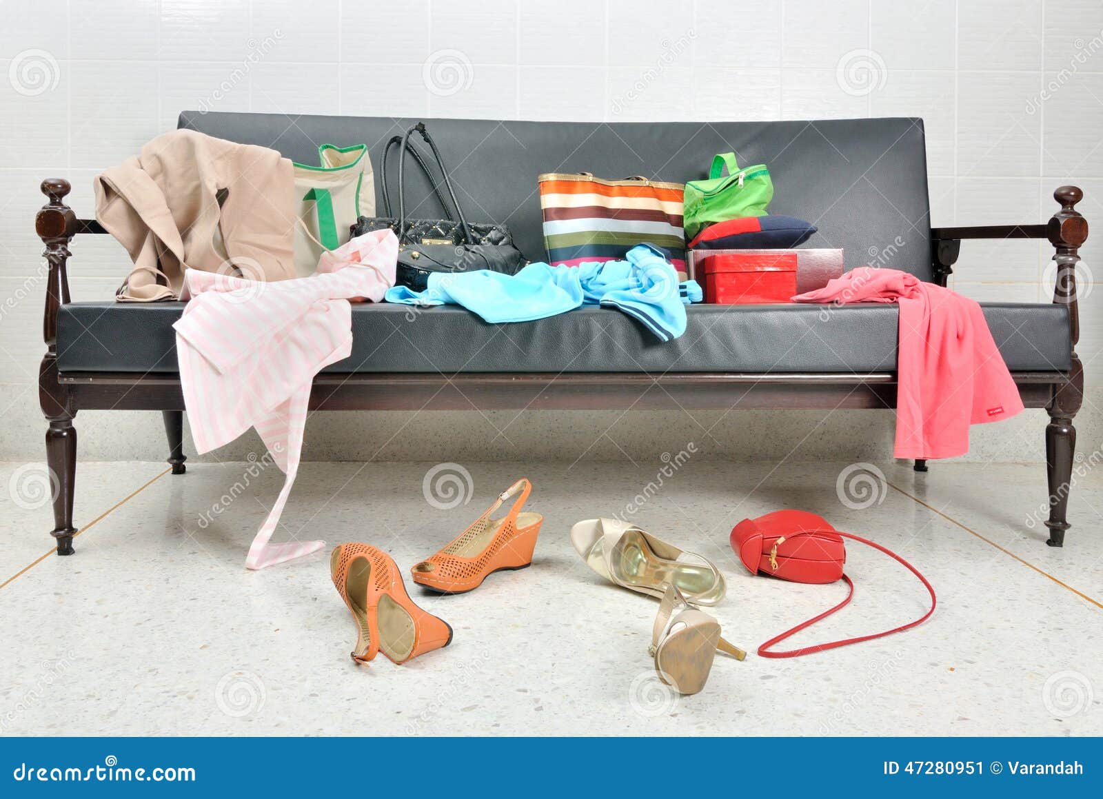 Messy Clothes, Lady Bag and Shoes Scattered on a Sofa Stock Image ...