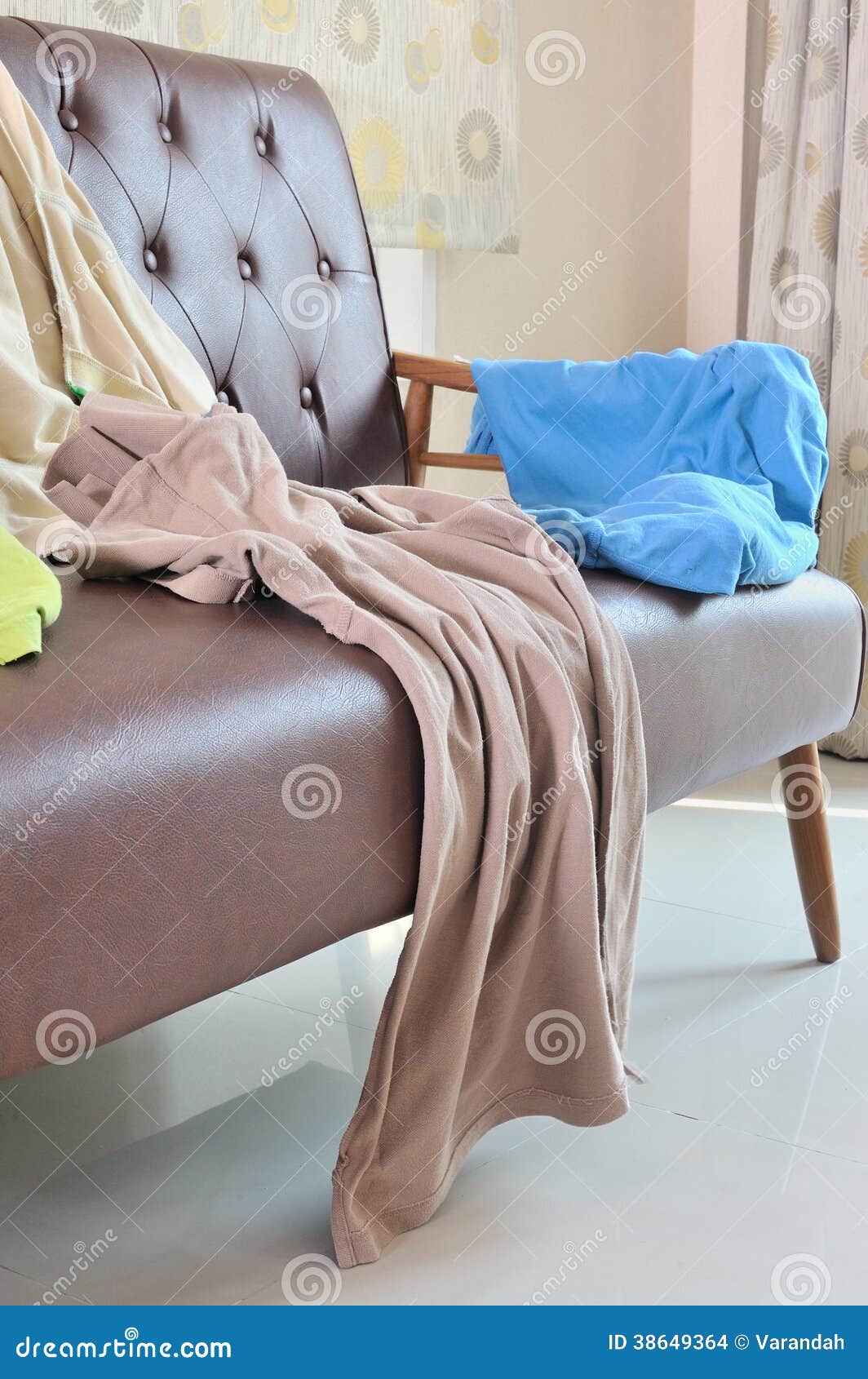 Messy Clothes Scattered on a Sofa Stock Photo - Image of fabric ...