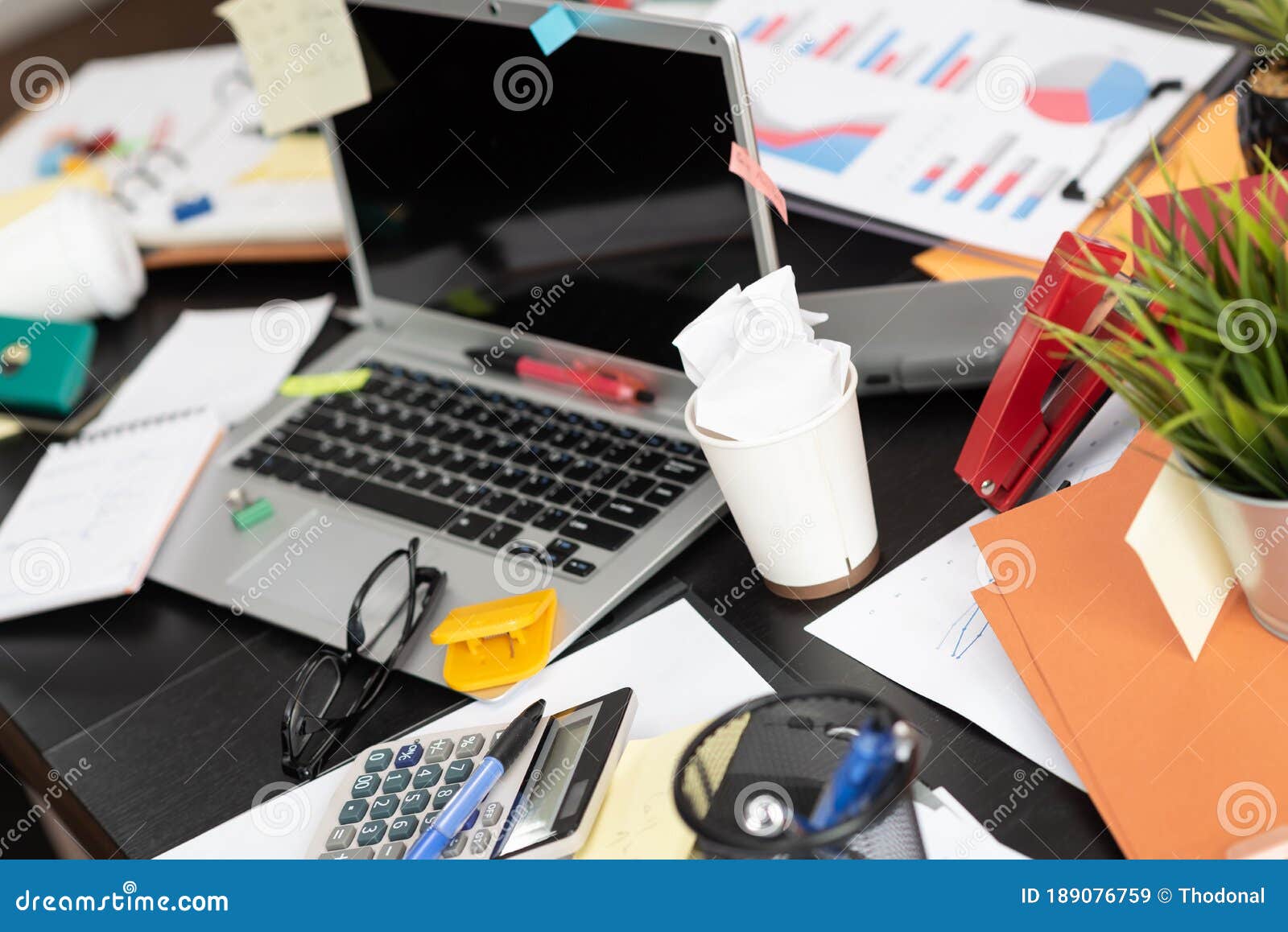 Messy and cluttered desk stock image. Image of document - 189076759