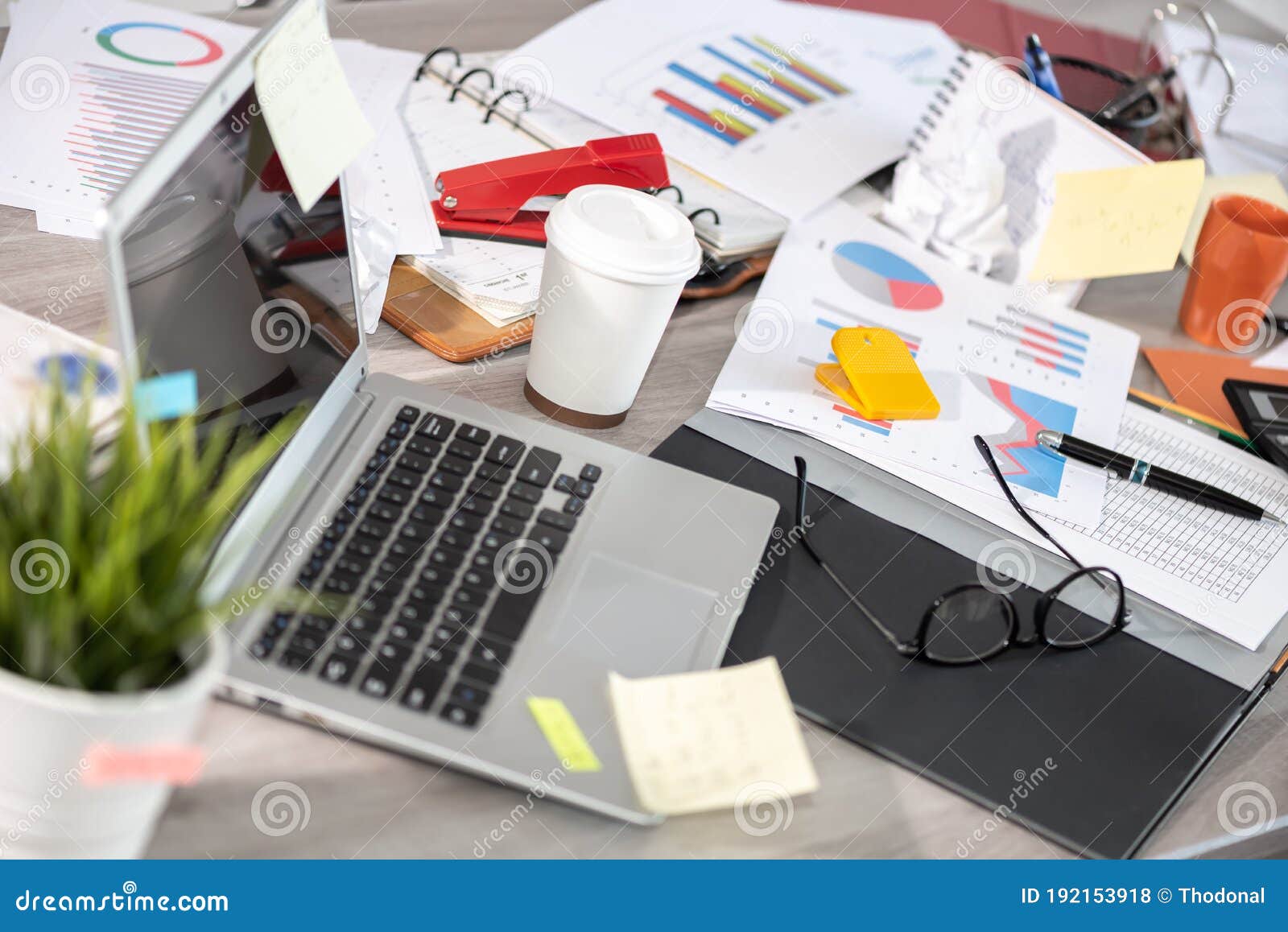 Messy and cluttered desk stock photo. Image of overwhelmed - 192153918