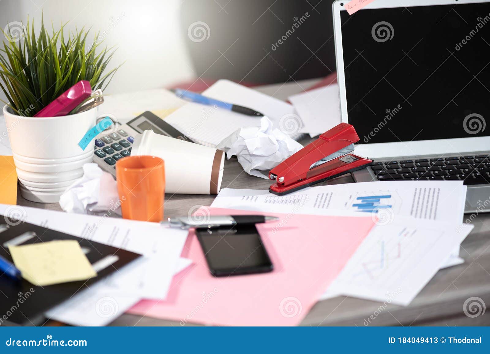 Messy and cluttered desk stock image. Image of workplace - 184049413
