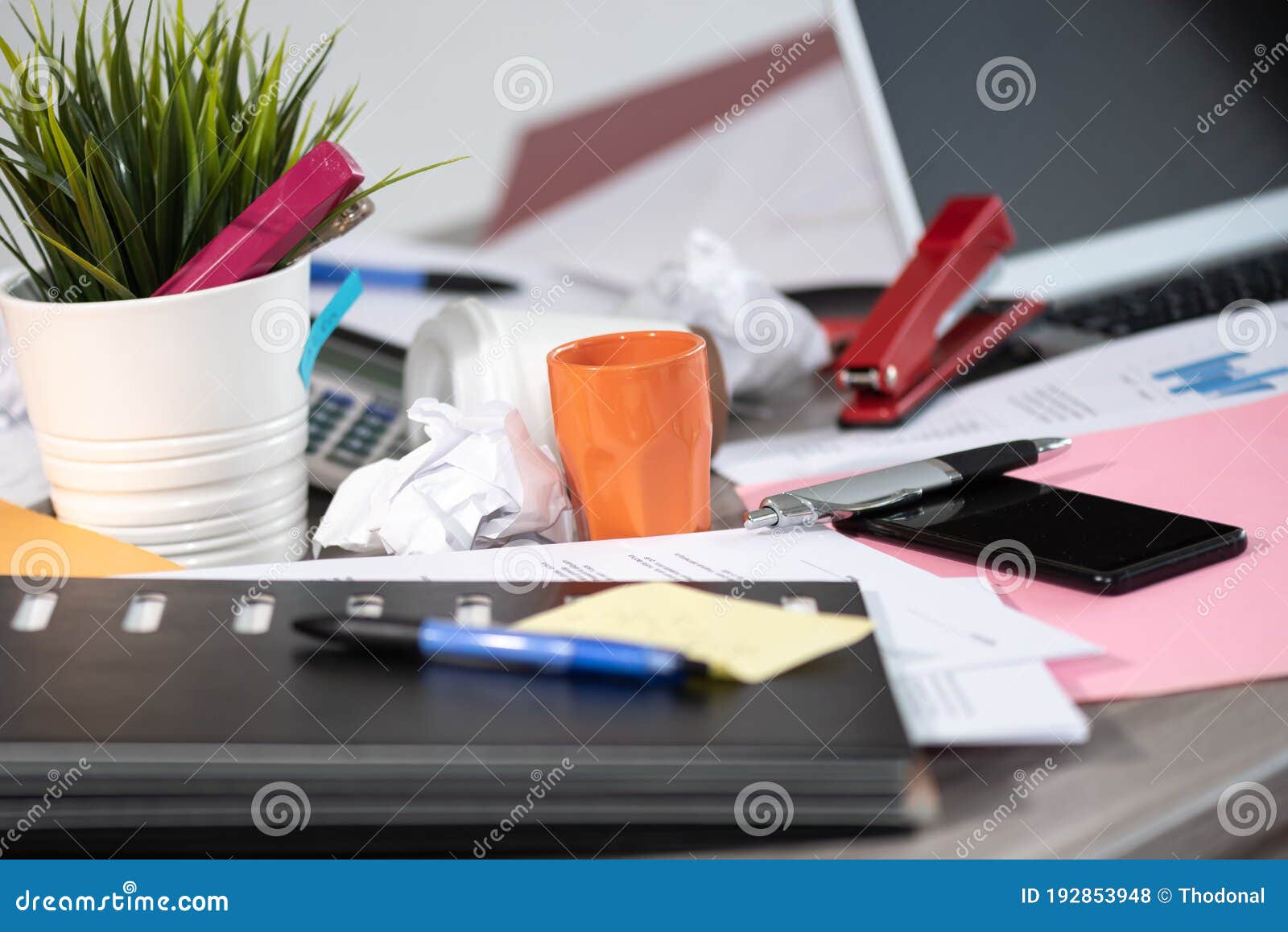 Messy and cluttered desk stock photo. Image of paper - 192853948