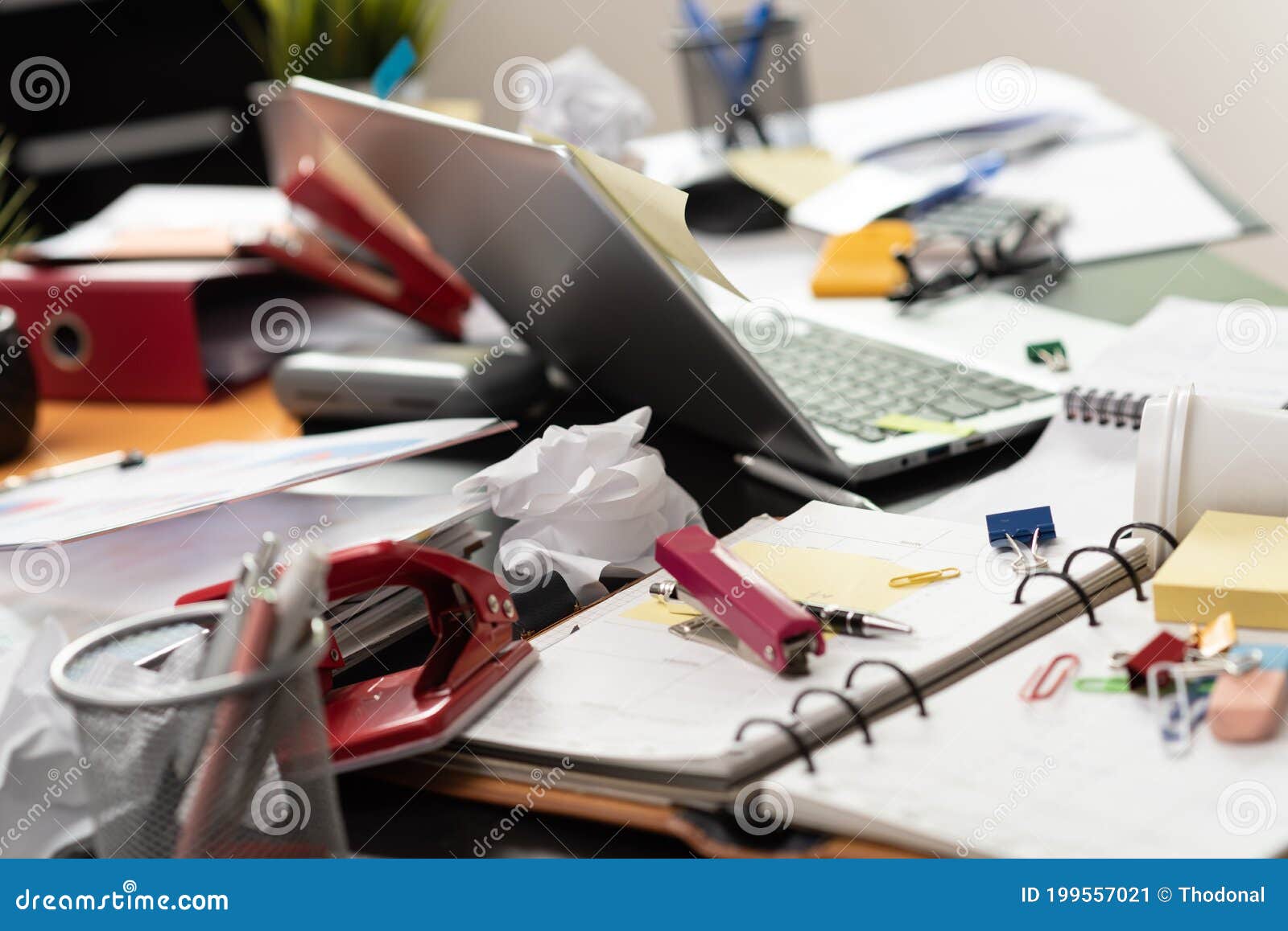 Messy and cluttered desk stock image. Image of office - 199557021