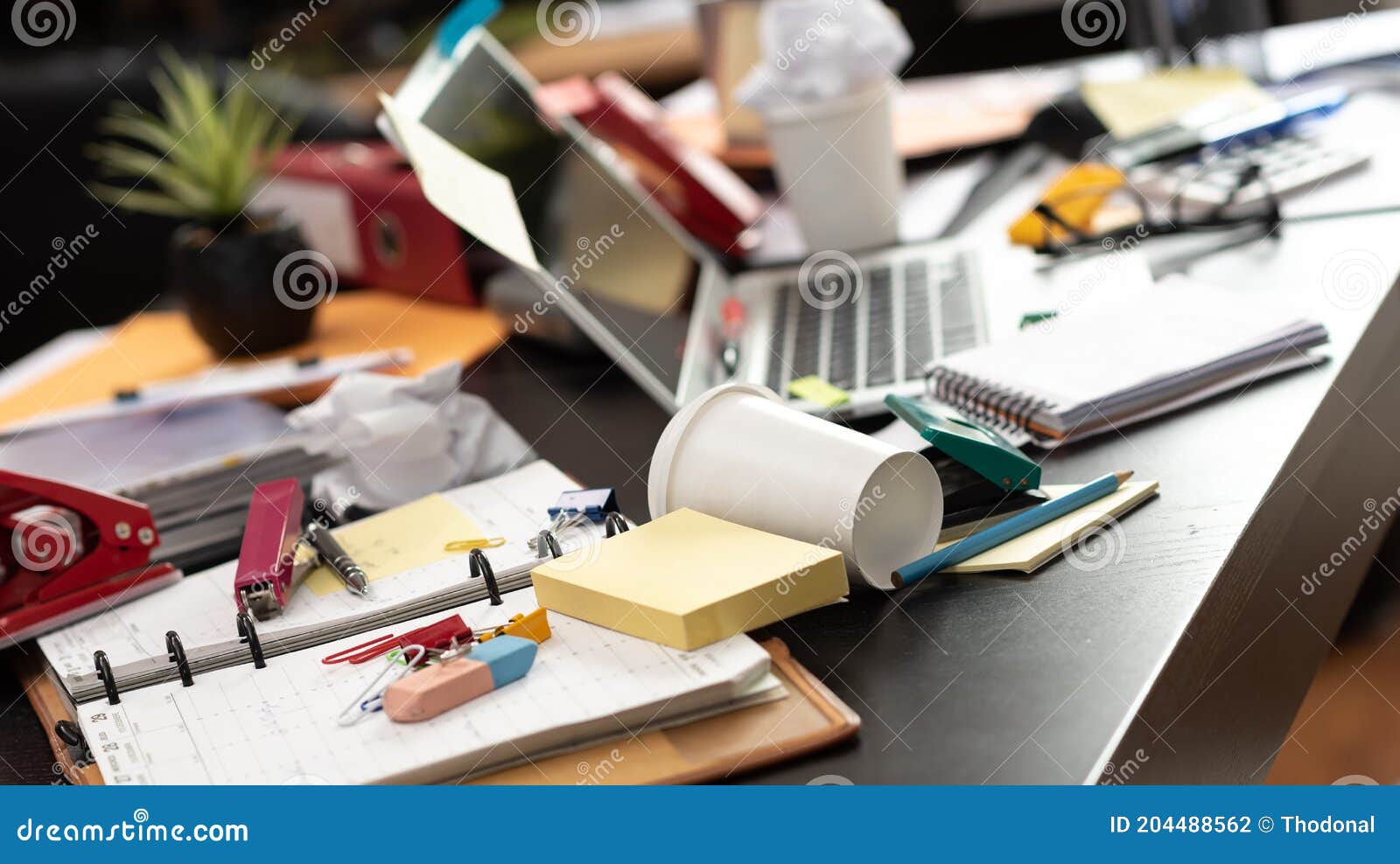 Messy and cluttered desk stock photo. Image of mess - 204488562