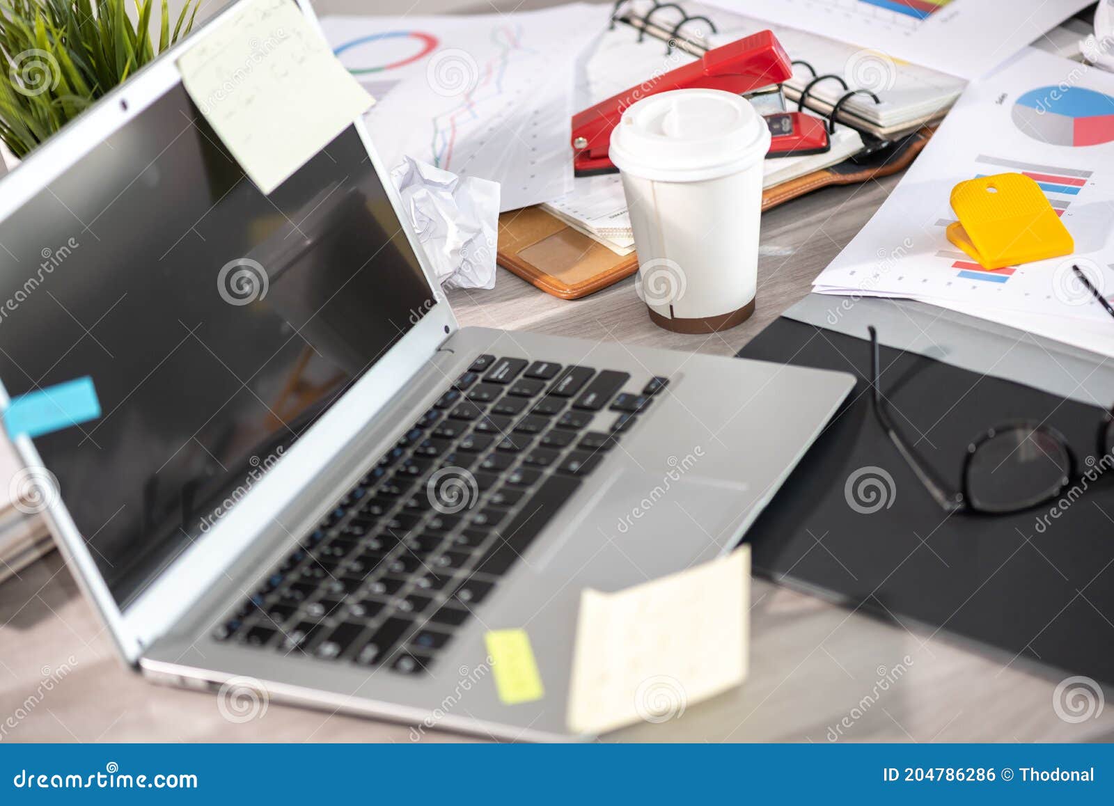 Messy and cluttered desk stock photo. Image of chaos - 204786286