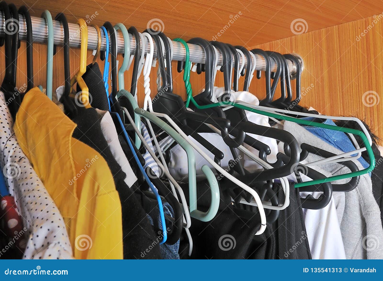 Messy Coat Hanger on the Rack in the Cabinet Stock Image - Image of ...