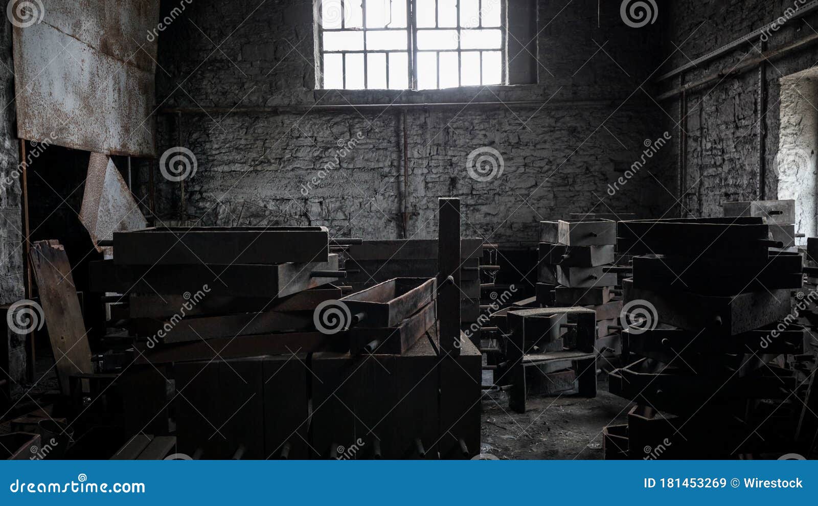 Messy Room with Stacks of Metal and a Concrete Brick Wall of a Building ...
