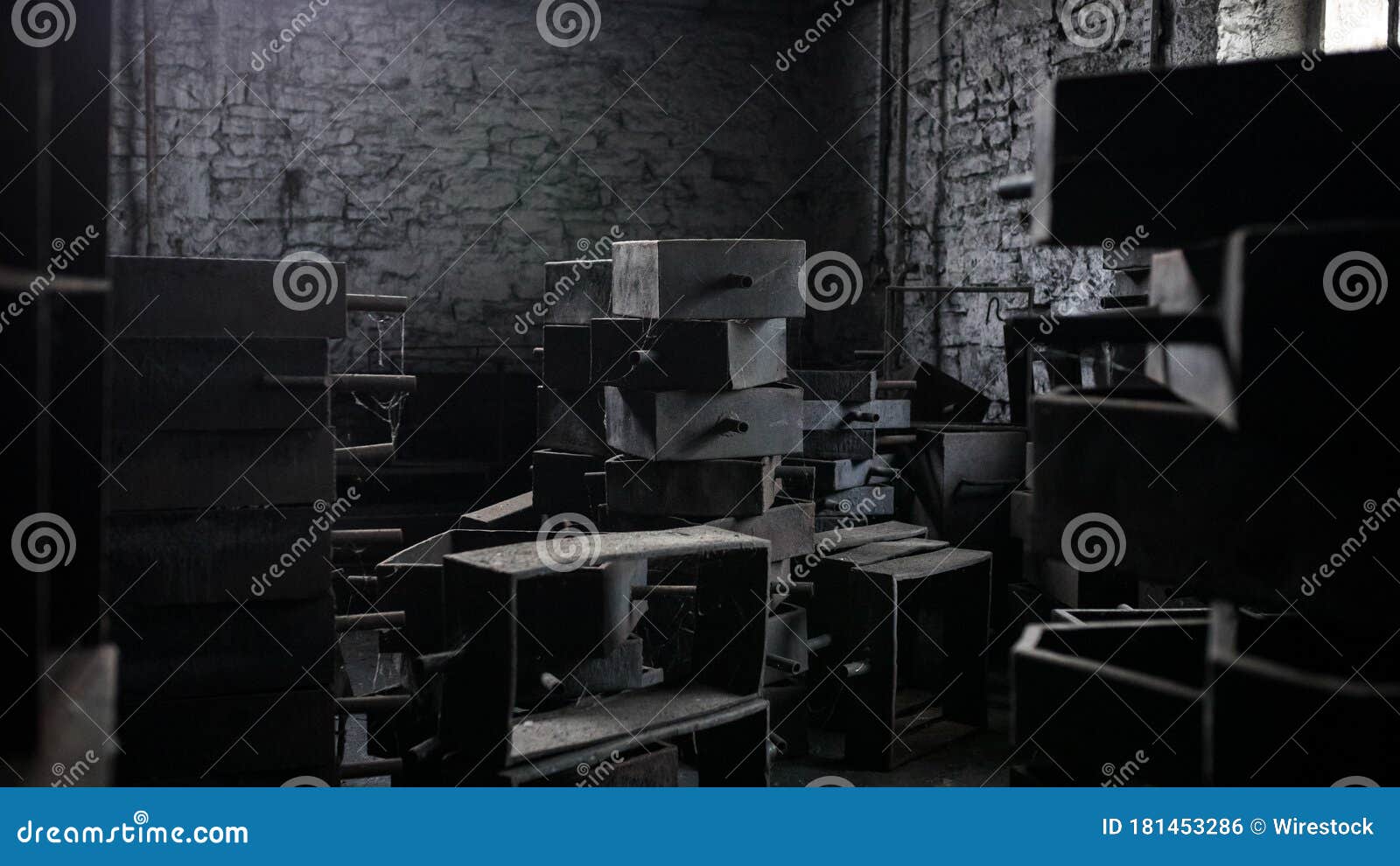 Messy Room with Stacks of Metal and a Concrete Brick Wall of a Building ...