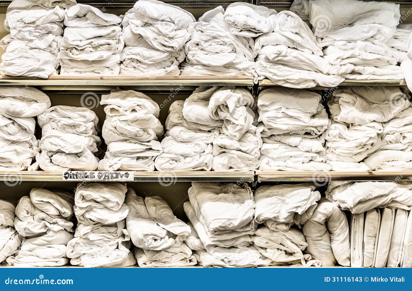 Messy Sheets on Shelves stock image. Image of heap, furniture - 31116143