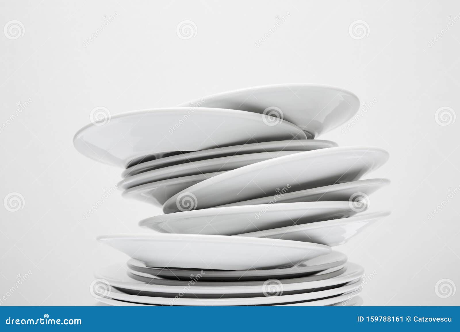 Messy Stack of White Plates about To Fall, Isolated on White Stock ...