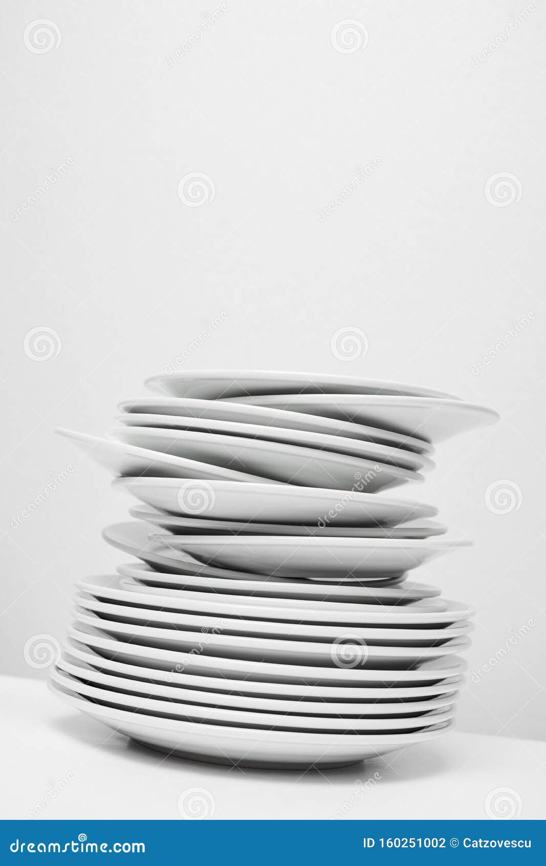Messy Stack of White Plates about To Fall, Isolated on White Stock ...