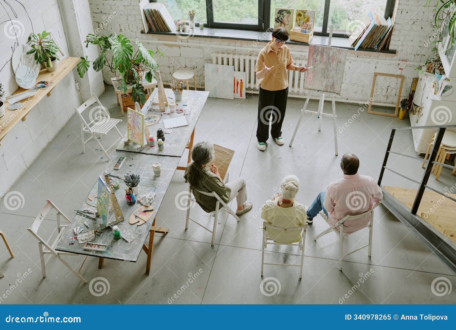Messy Studio with People stock image. Image of lesson - 340978265
