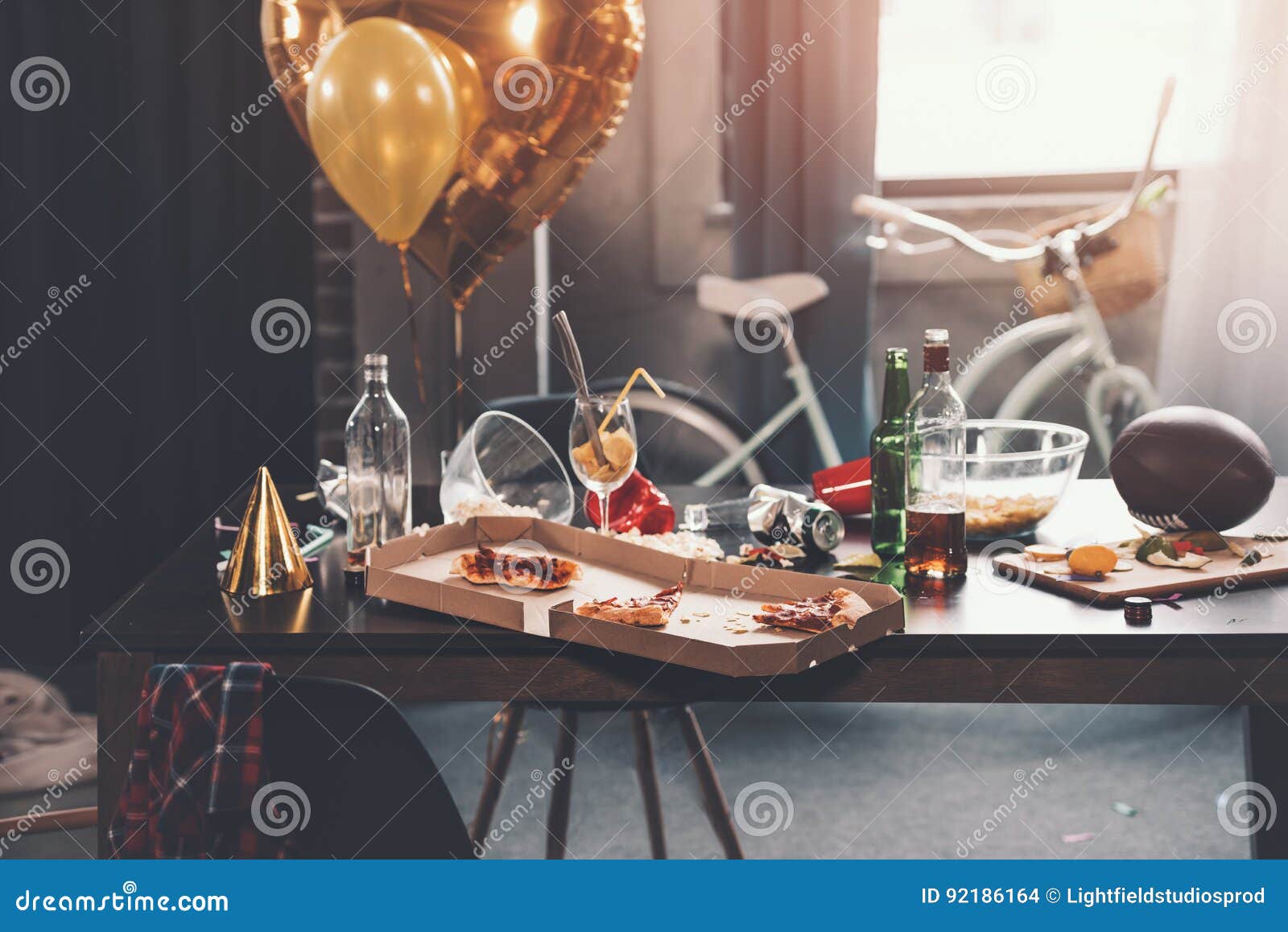 Messy Table with Pizza in Box and Beverages at Morning Stock Photo ...