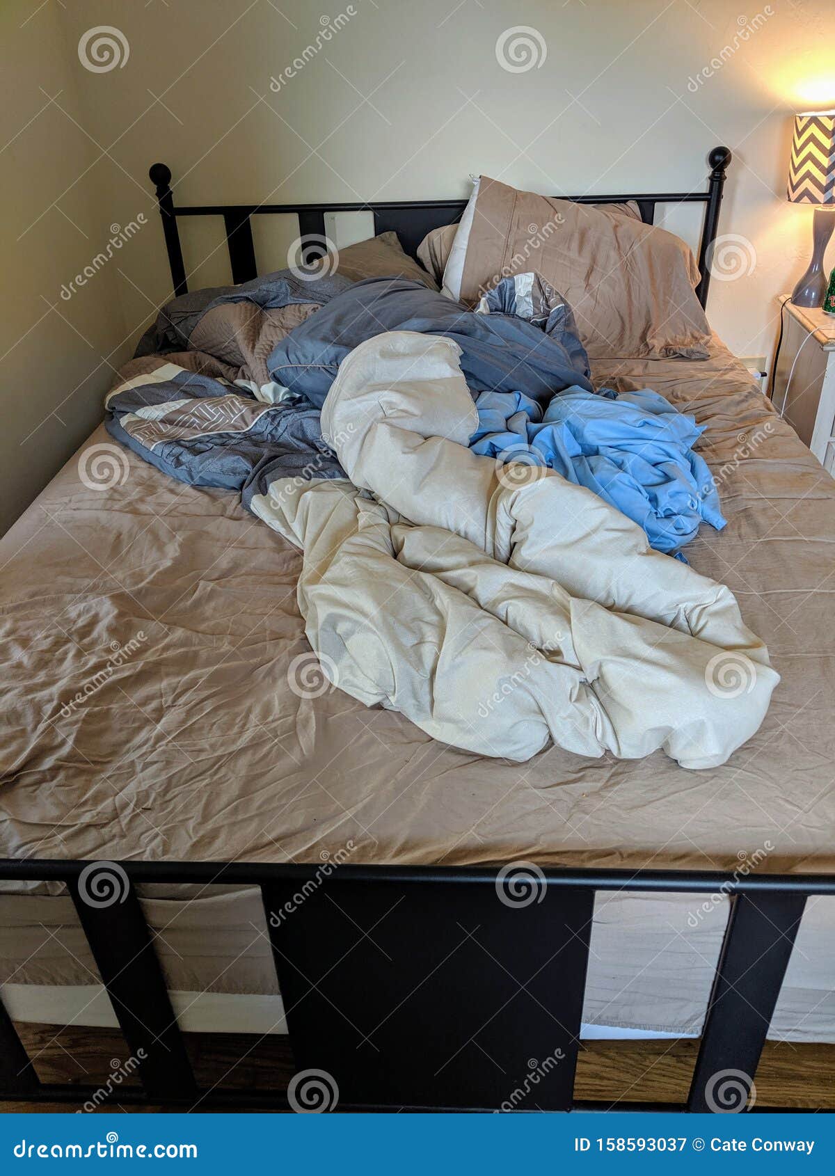 Messy, Unmade Metal Framed Bed Stock Image - Image of unmade, messy ...