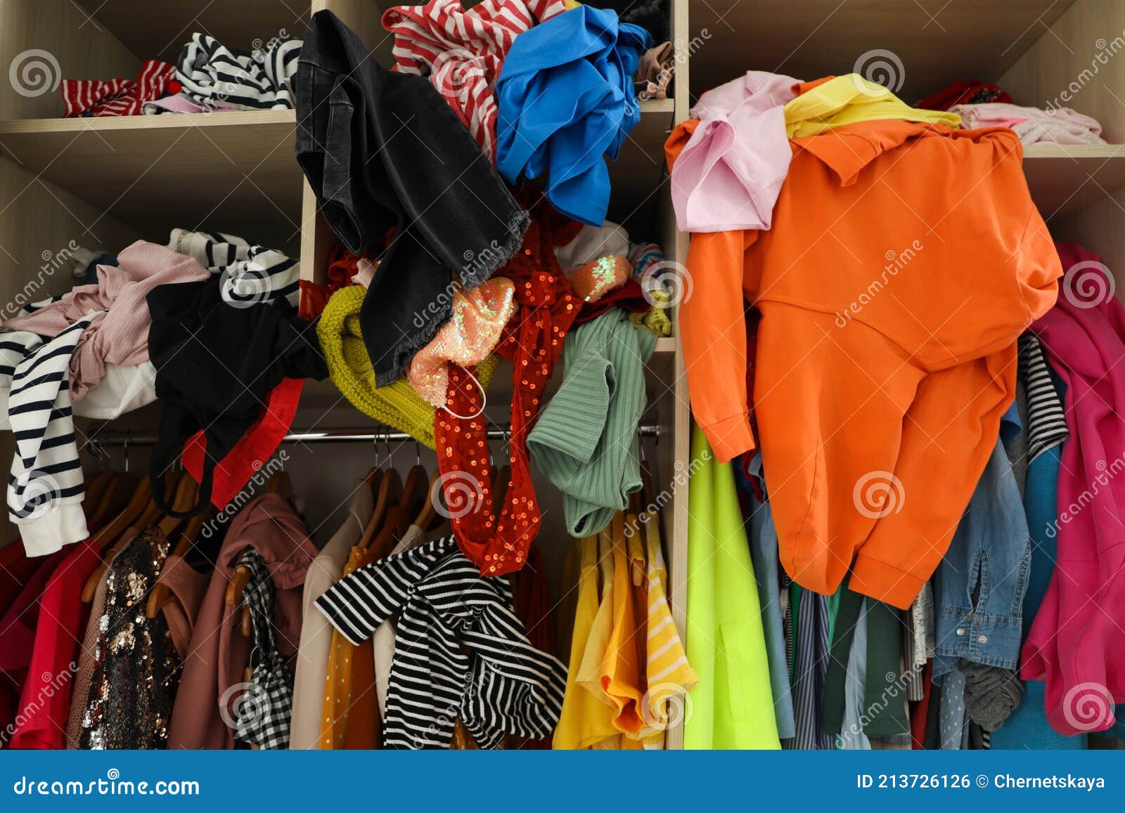 Messy Wardrobe With Different Clothes Indoors. Fast Fashion Concept ...