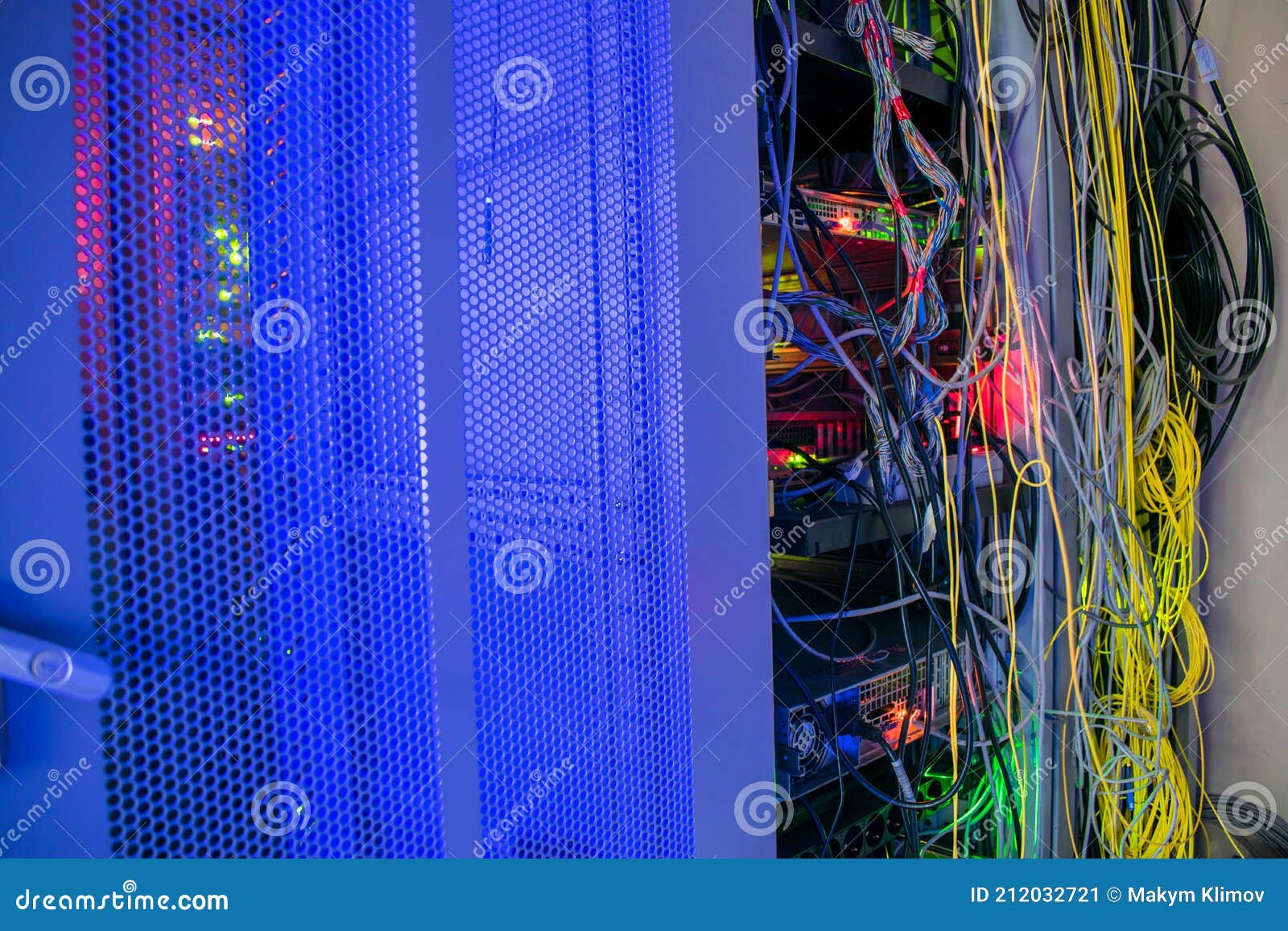 Messy Wires Are In The Switch Rack. A Bright Display Glows On The ...