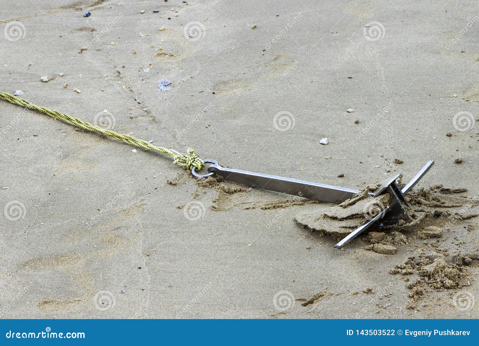 Metal Anchor with a Tied Rope on the Sand Stock Photo - Image of beach ...
