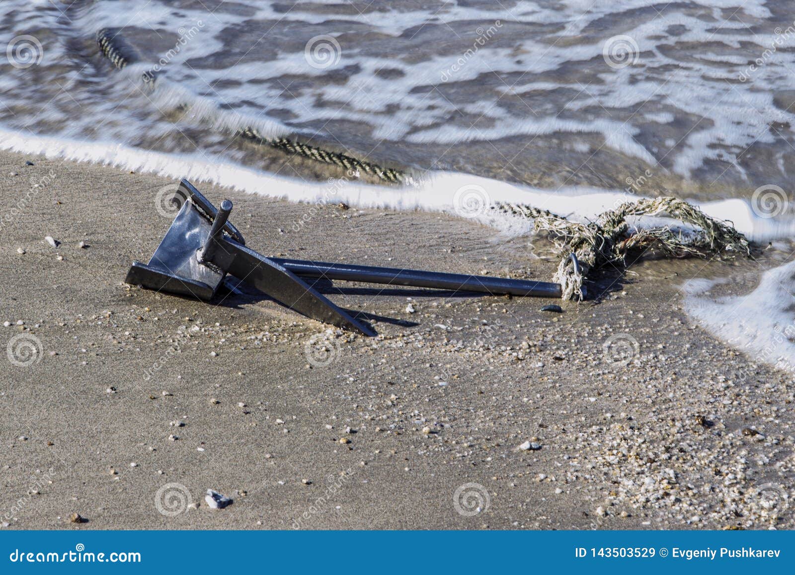 Metal Anchor with a Tied Rope on the Sand Stock Image - Image of object ...