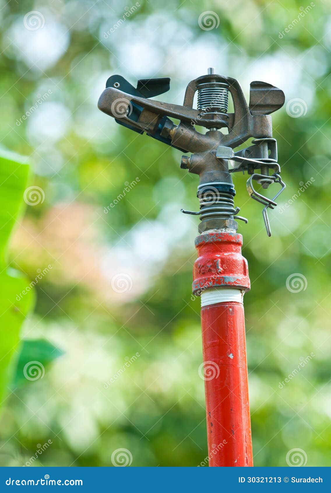 Metal Automatic Water Sprinkler Stock Image - Image of garden, nature ...
