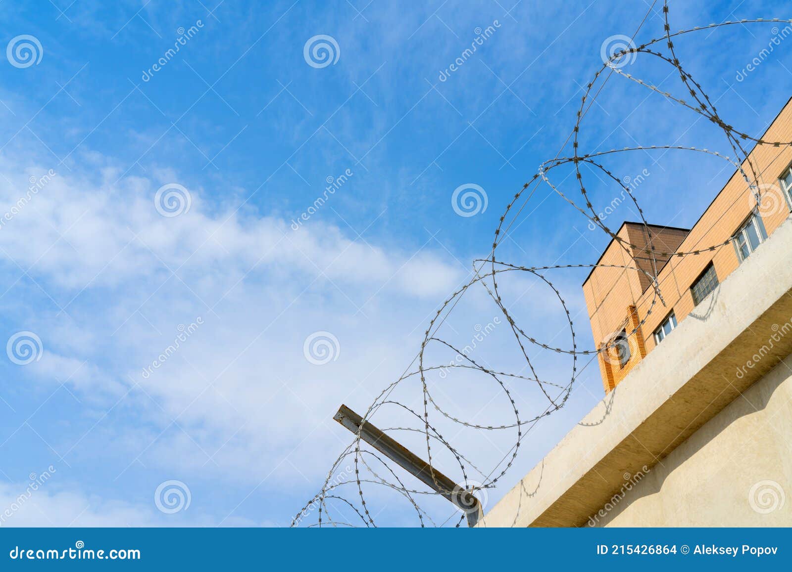 Metal Barbed Wire on the Prison Wall. Stock Photo - Image of barb ...