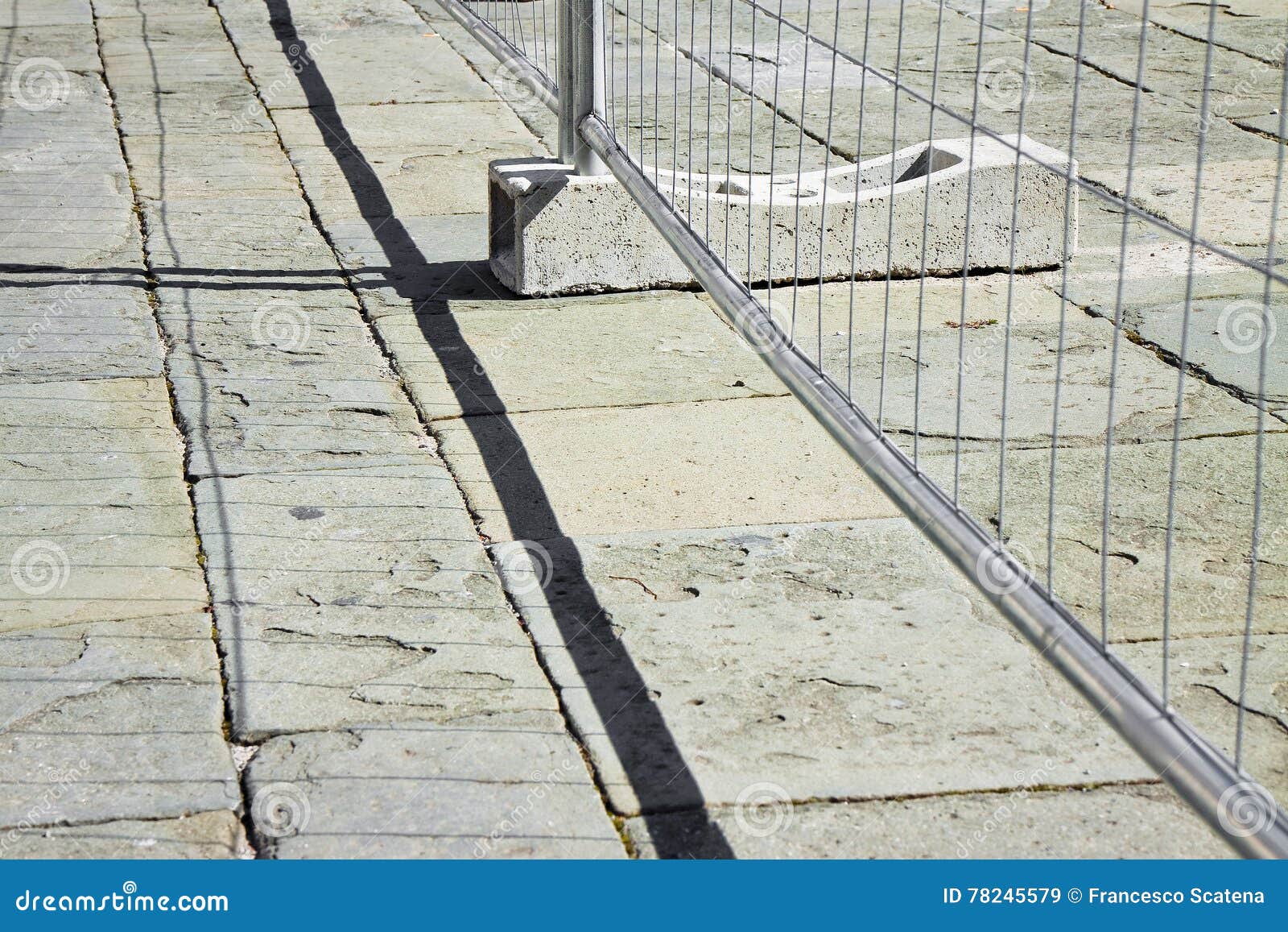 Metal Barrier in a Stone Road Stock Image - Image of barrier, stone ...