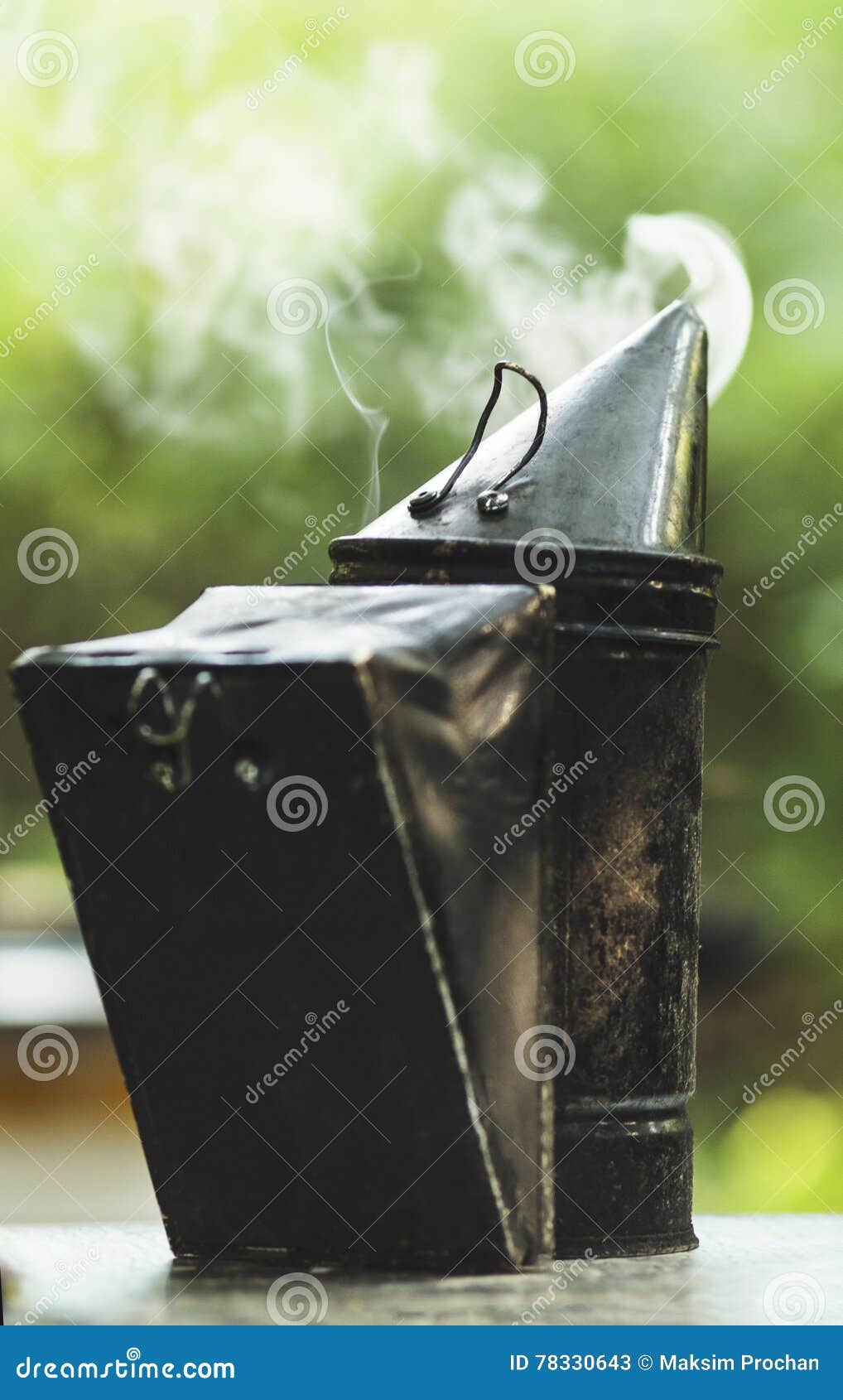 Metal bee smoker smokes stock image. Image of material - 78330643