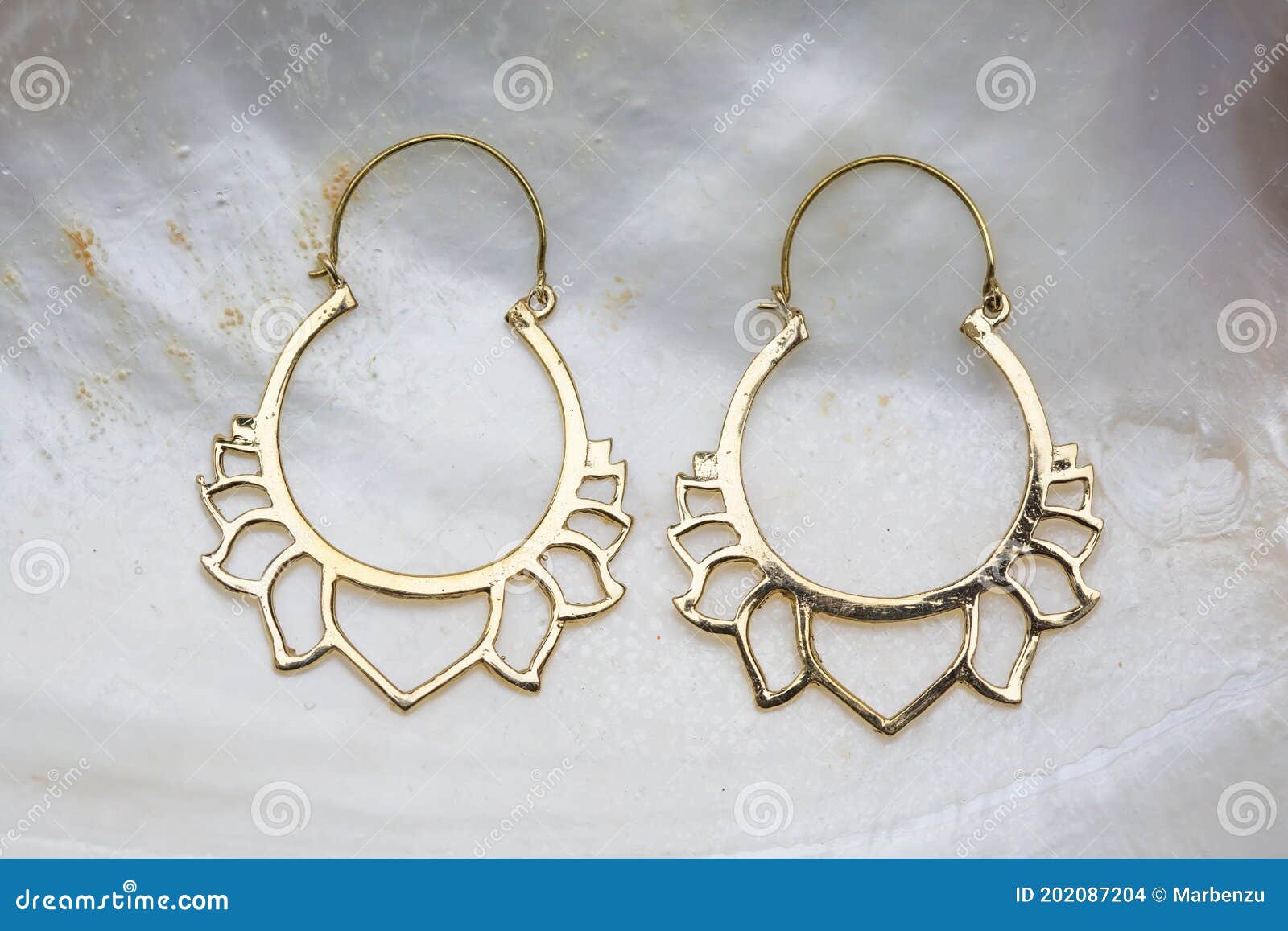 Metal Boho Earrings in the Shape of Lotus Stock Photo - Image of ...