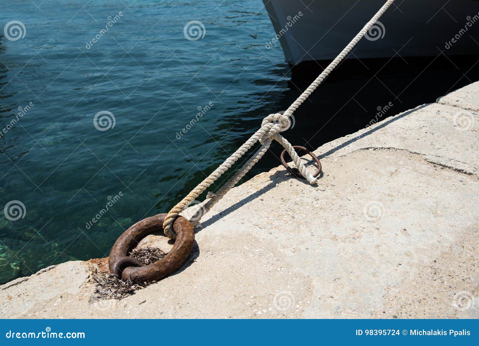Metal Bollard and Rope Securing a Ship Stock Photo - Image of rope ...