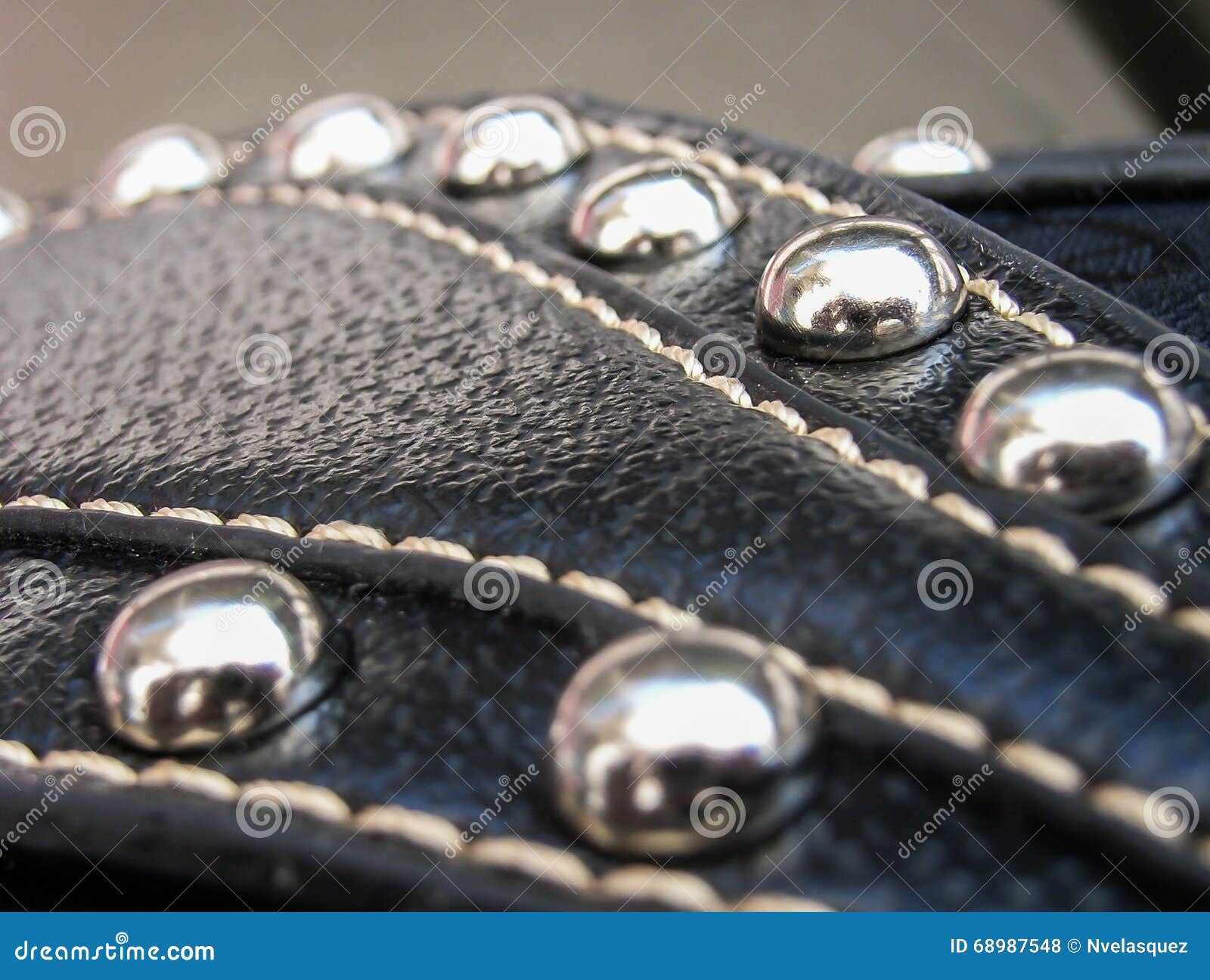 Metal buttons and leather stock photo. Image of leather - 68987548