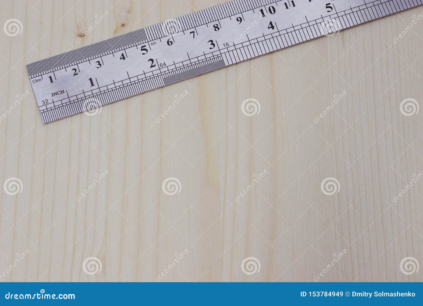 Metal Carpentry Ruler on a Light Wooden Background Stock Image - Image ...