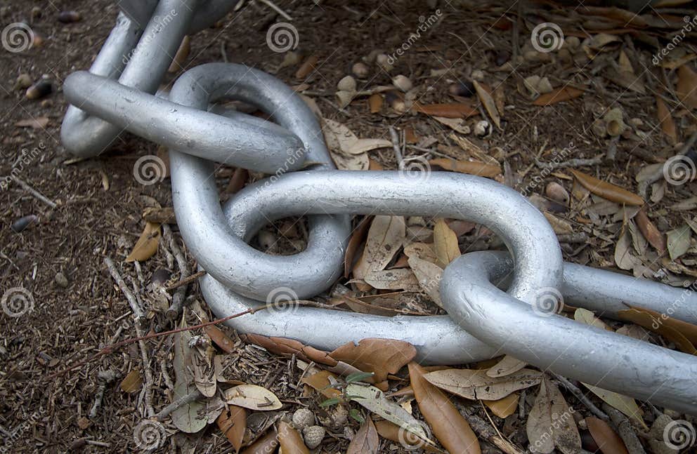 A Metal Chain on the Ground Stock Photo - Image of metal, pattern: 81677172