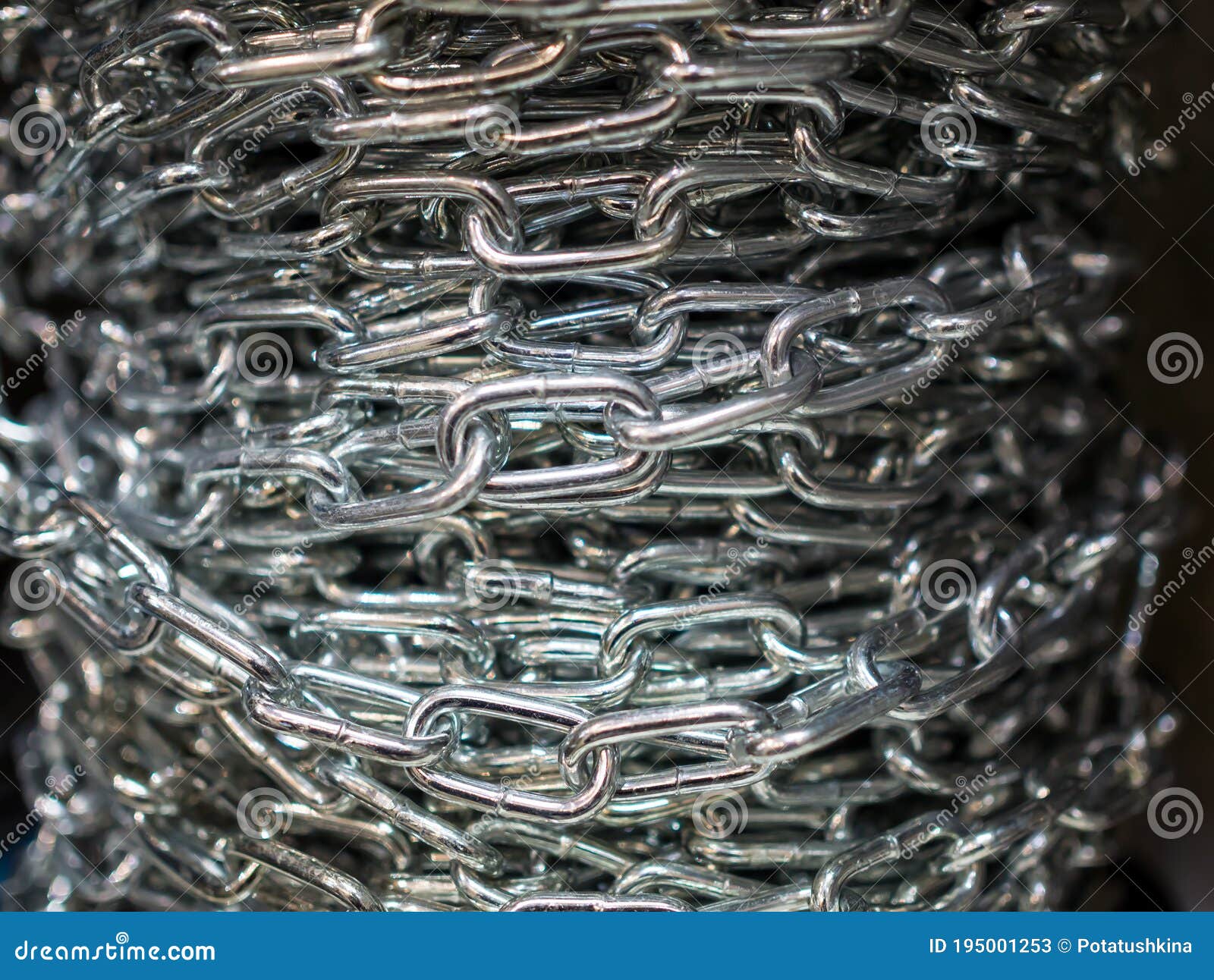 A Metal Chain Wound in a Small Coil Stock Image - Image of iron ...