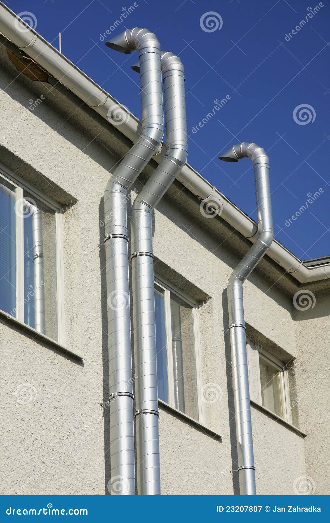 Metal Chimneys And Ventilation Pipes With Wind Deflectors Royalty-Free ...
