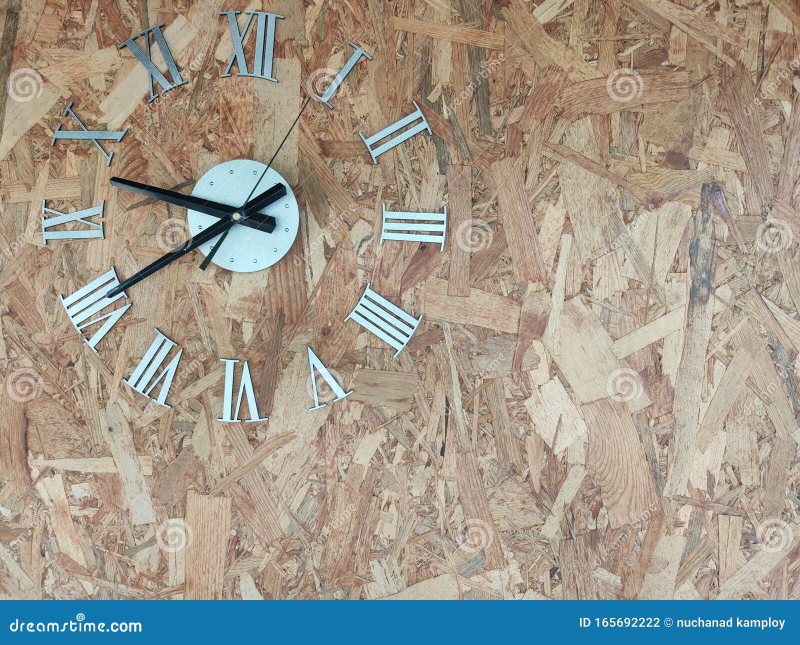 Metal Clock Stuck on a Wooden Wall. Stock Photo - Image of wall, metal ...